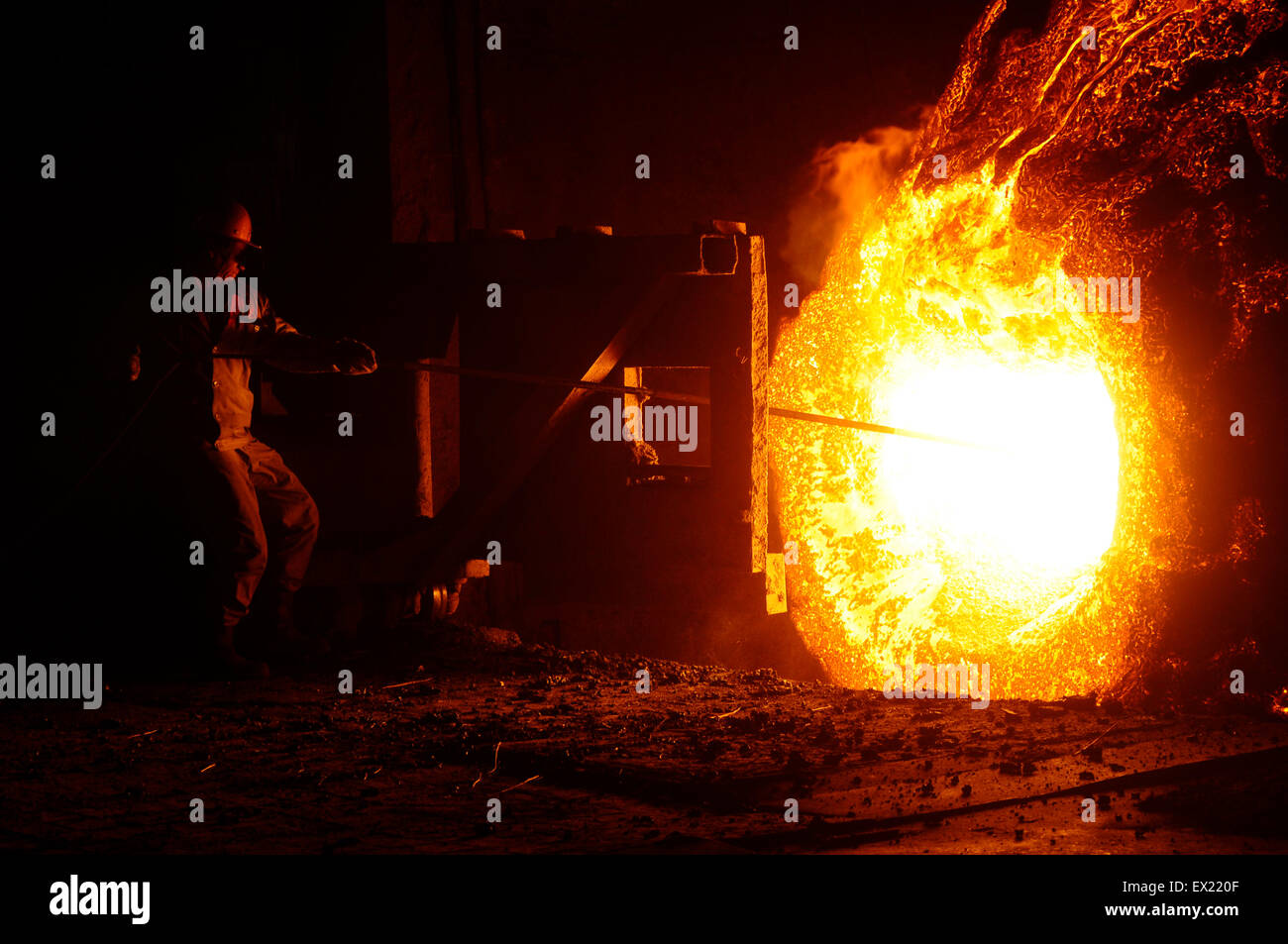 Labourers work at a workshop of a steel and iron factory in Changzhi ...