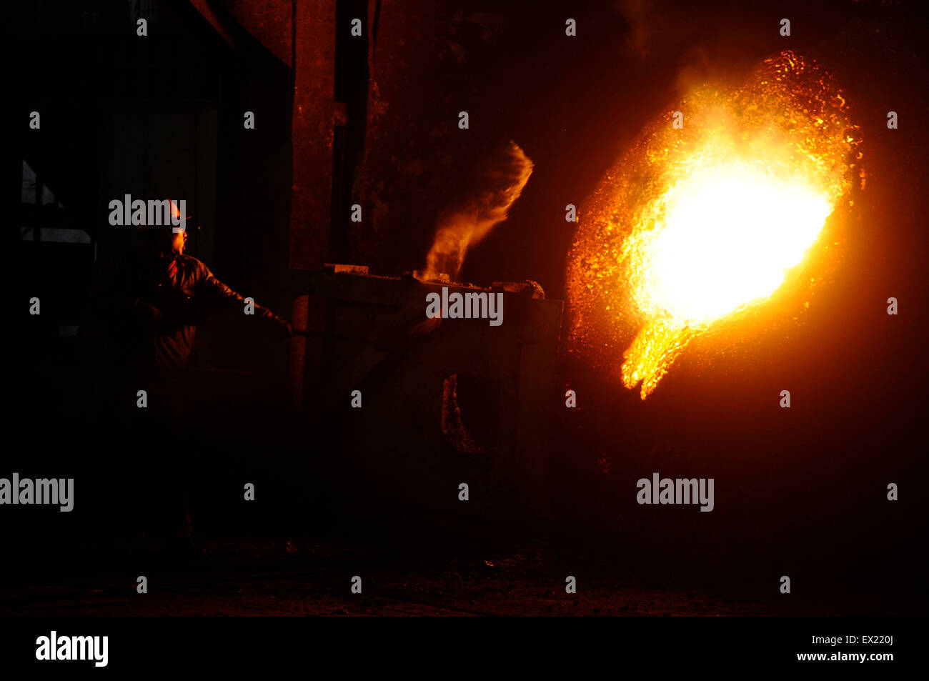 Labourers work at a workshop of a steel and iron factory in Changzhi ...