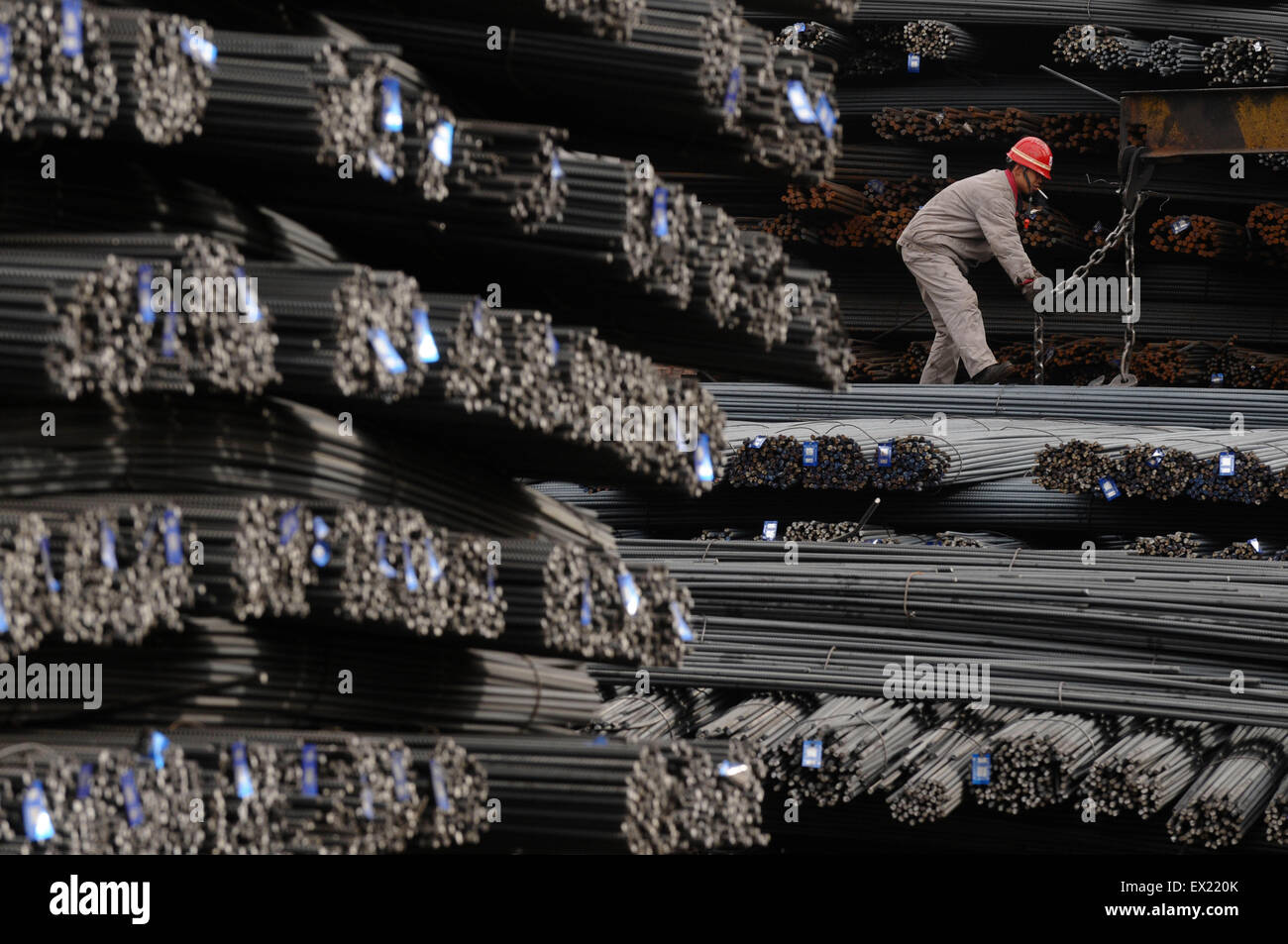 Labourers work at a workshop of a steel and iron factory in Changzhi ...