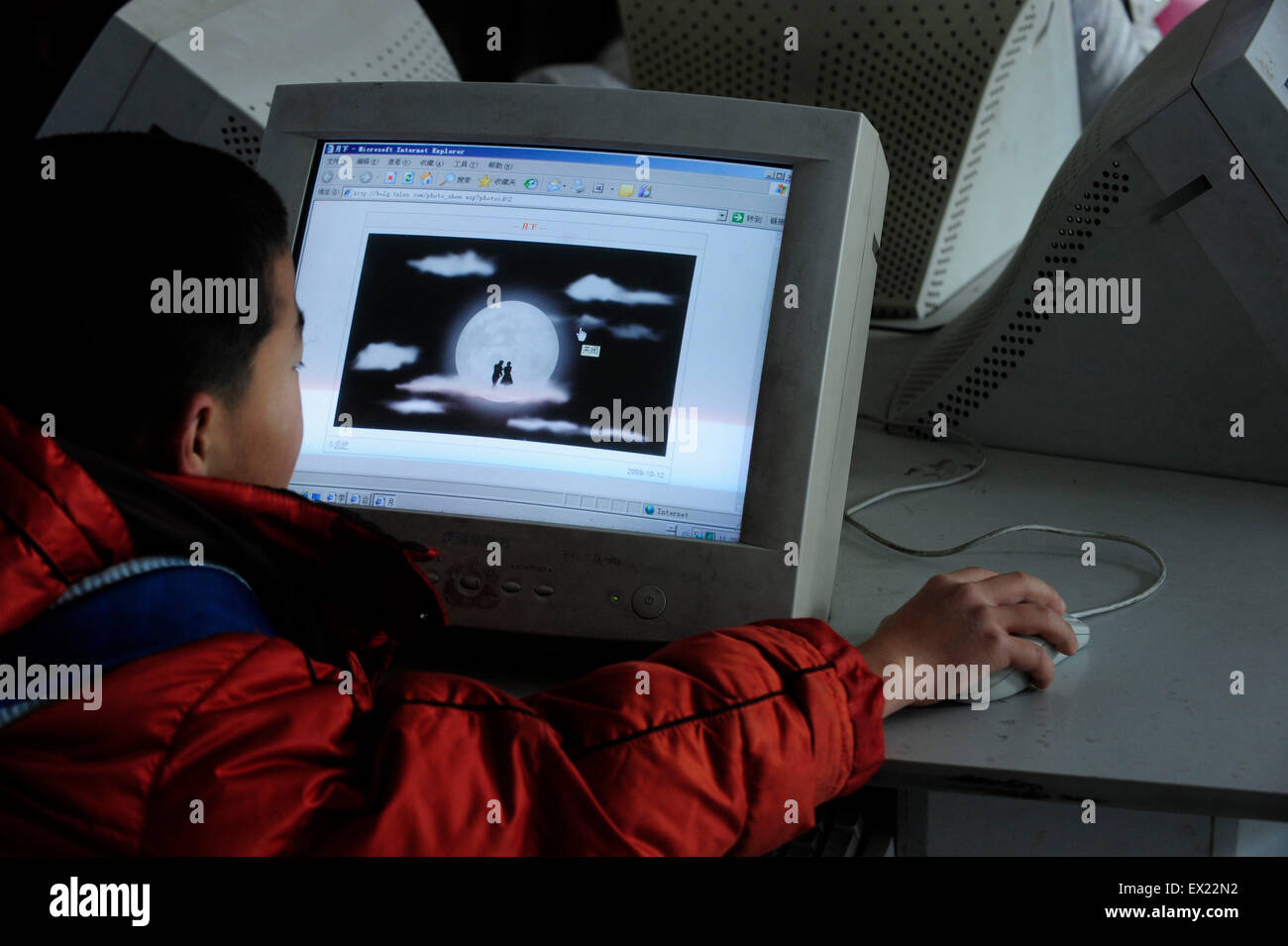 Children use computers at an internet room of a primary school in Hefei ...