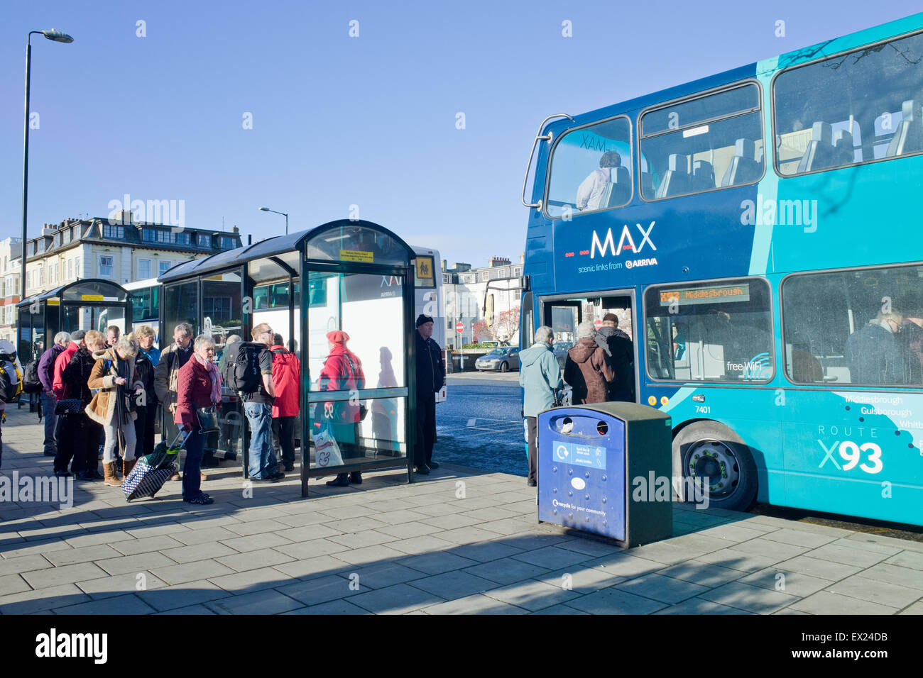 Queue of people at bus stop hi-res stock photography and images - Alamy