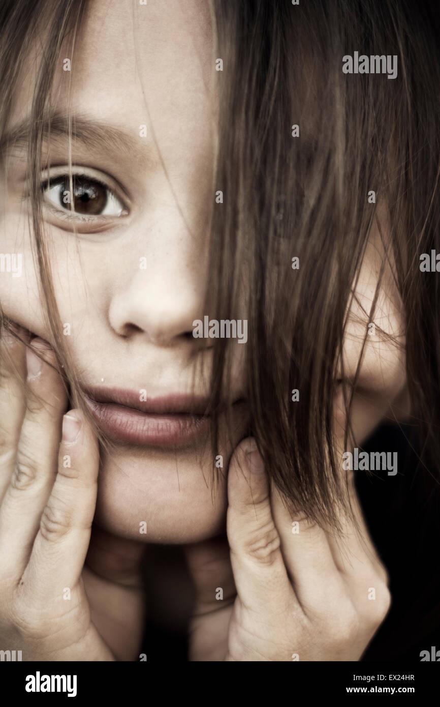 Young child making faces in close-up Stock Photo - Alamy
