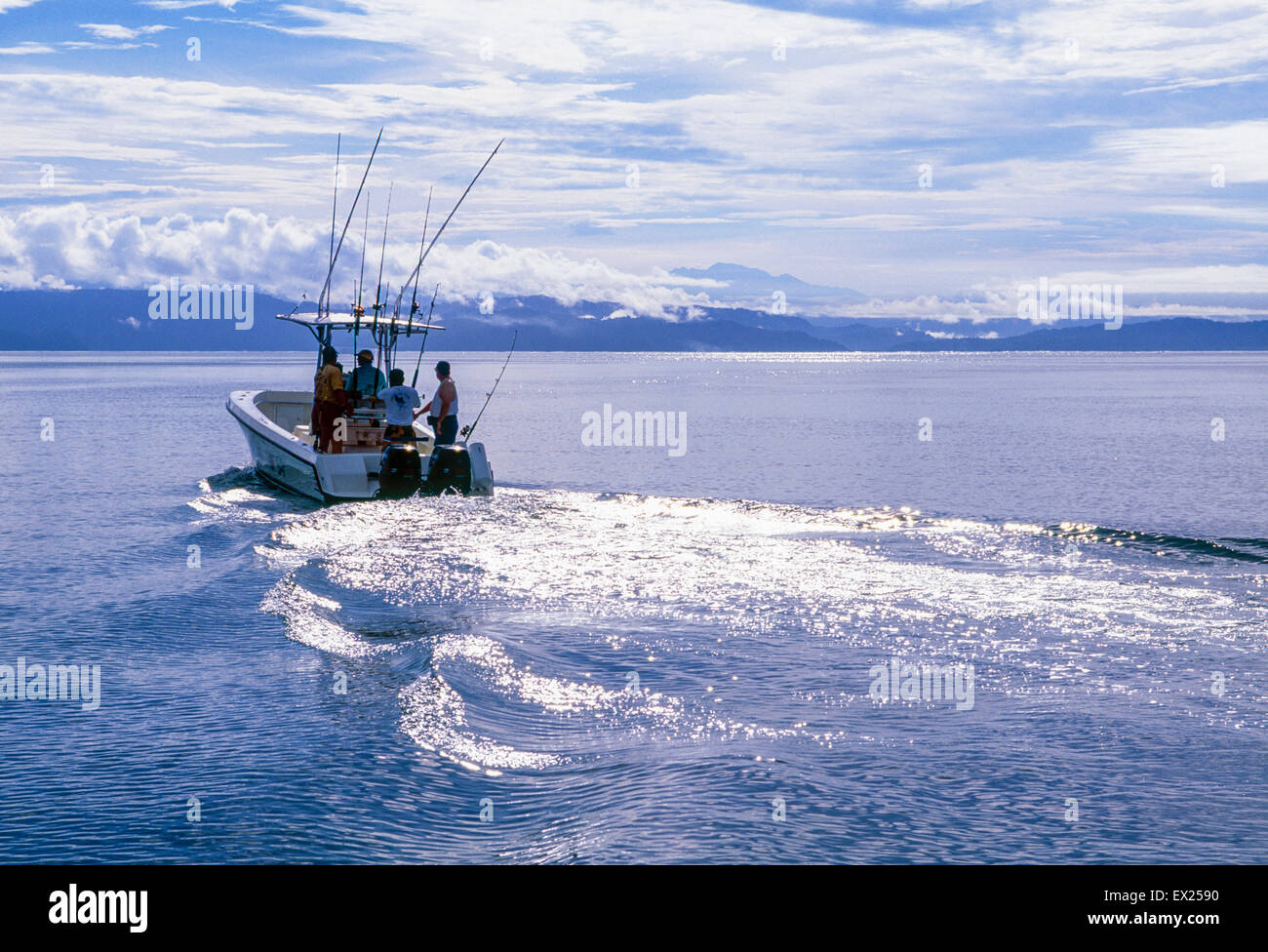 Deep sea fishing boat heading out into the Pacific through Golfo Dulce ...