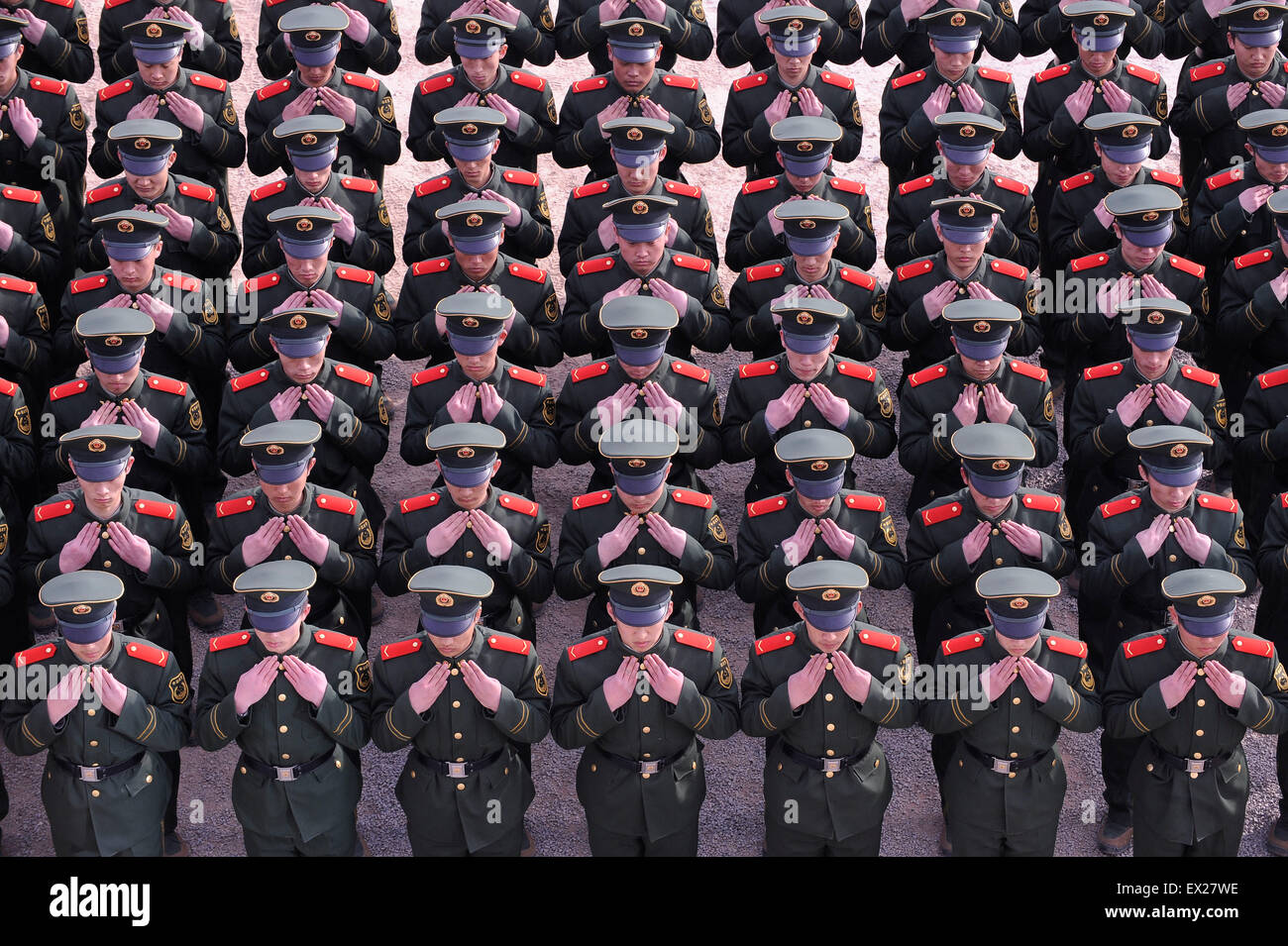 Recruits of paramilitary policeman check their dressing during a ...