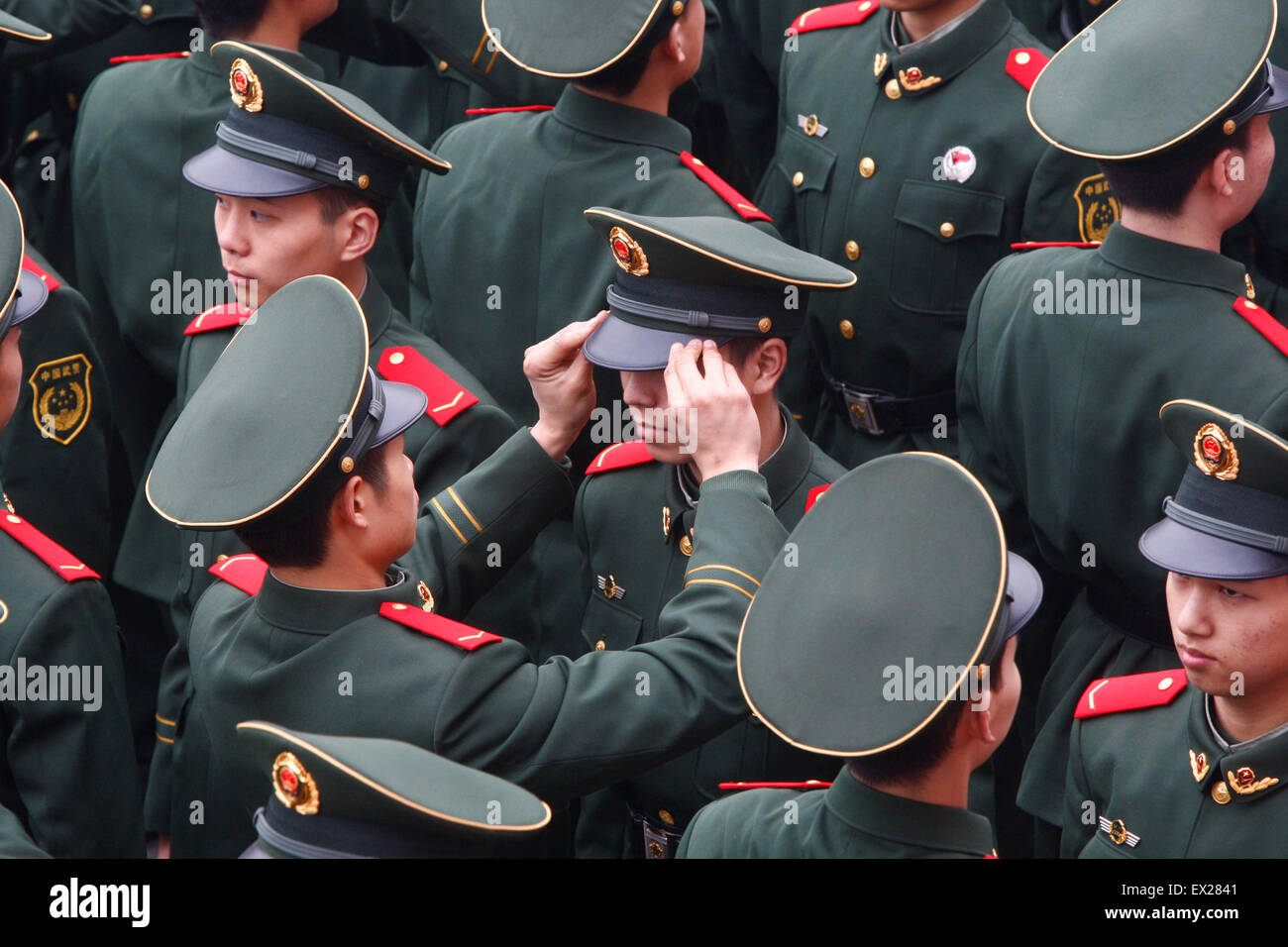 Recruits of the paramilitary police wear badges for each other on their ...