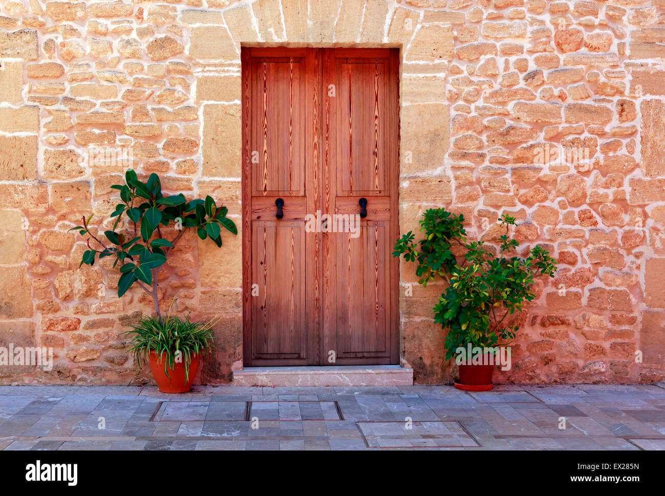 Wooden door of an old stone house, Spain Stock Photo - Alamy