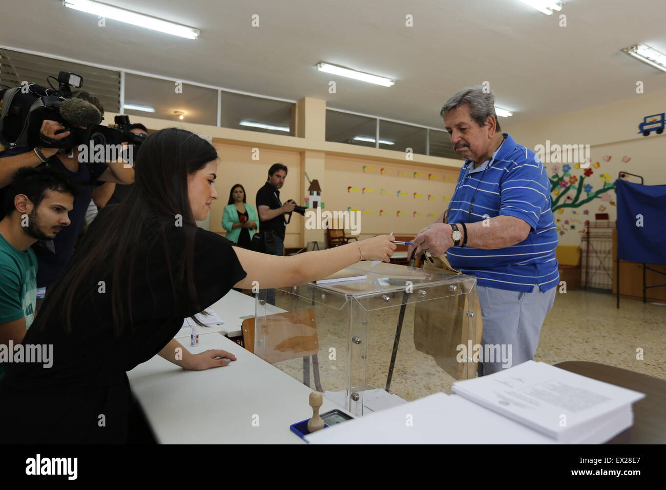 Athens, Greece. 05th July, 2015. A voter places his vote in the ballot ...