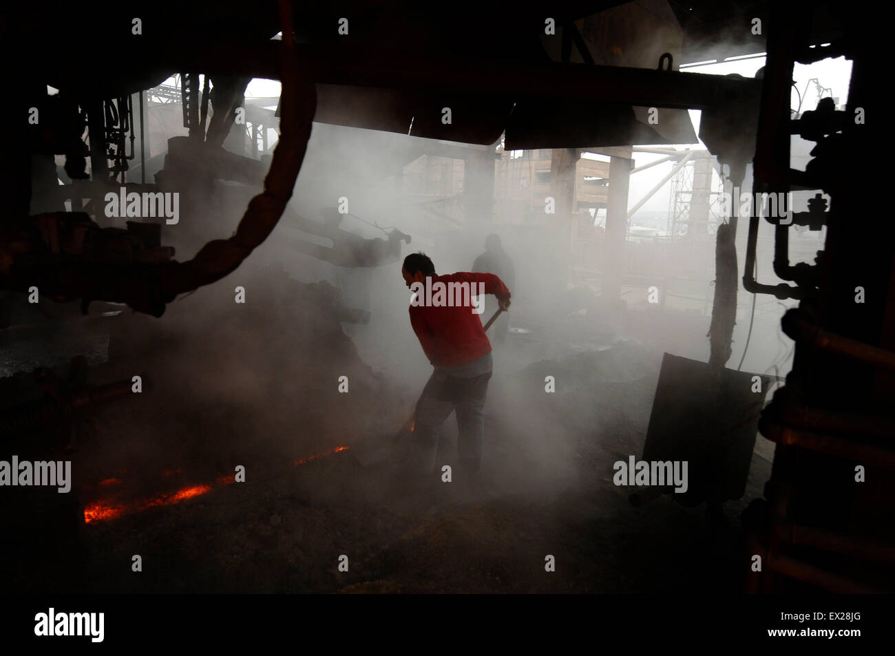 A labourer works at the Changning steel and iron factory in Changzhi ...
