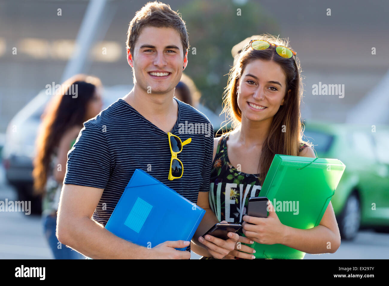 Portrait of young students looking at the camera after class Stock ...