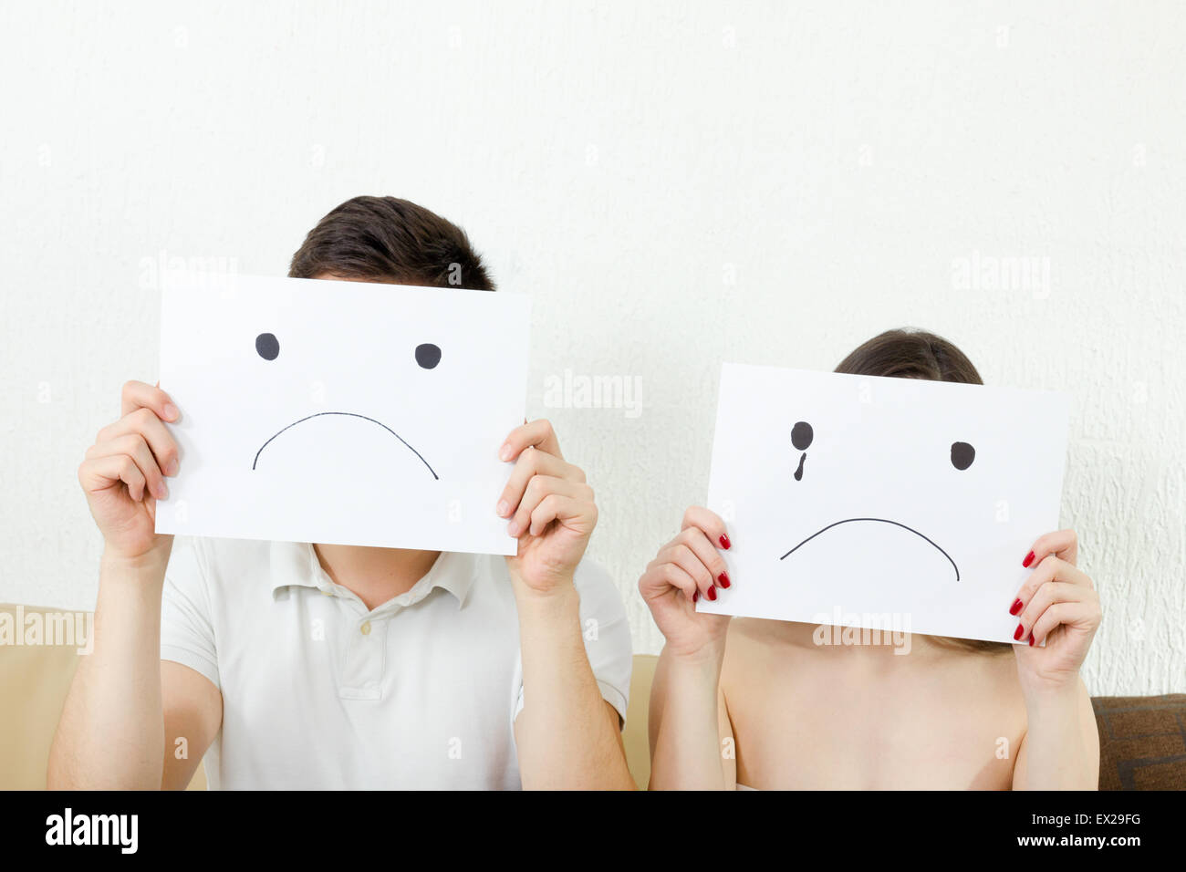 Sad young couple, young couple in despair.. Male and female with sad ...