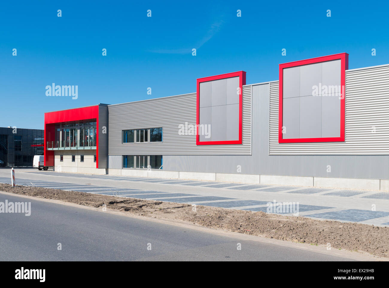 newly build modern red office building with warehouse Stock Photo - Alamy