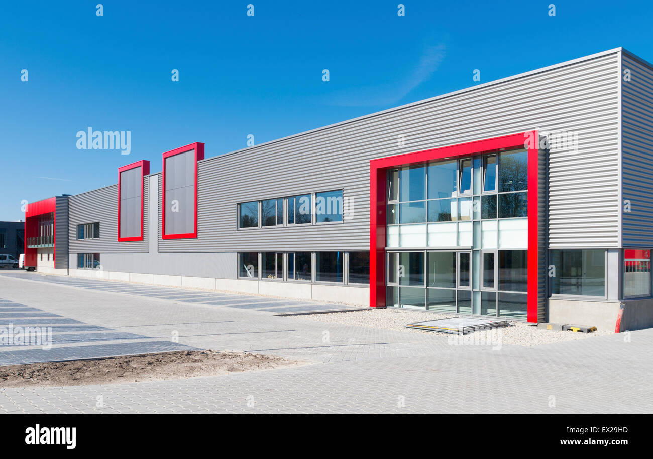 newly build modern red office building with warehouse Stock Photo - Alamy