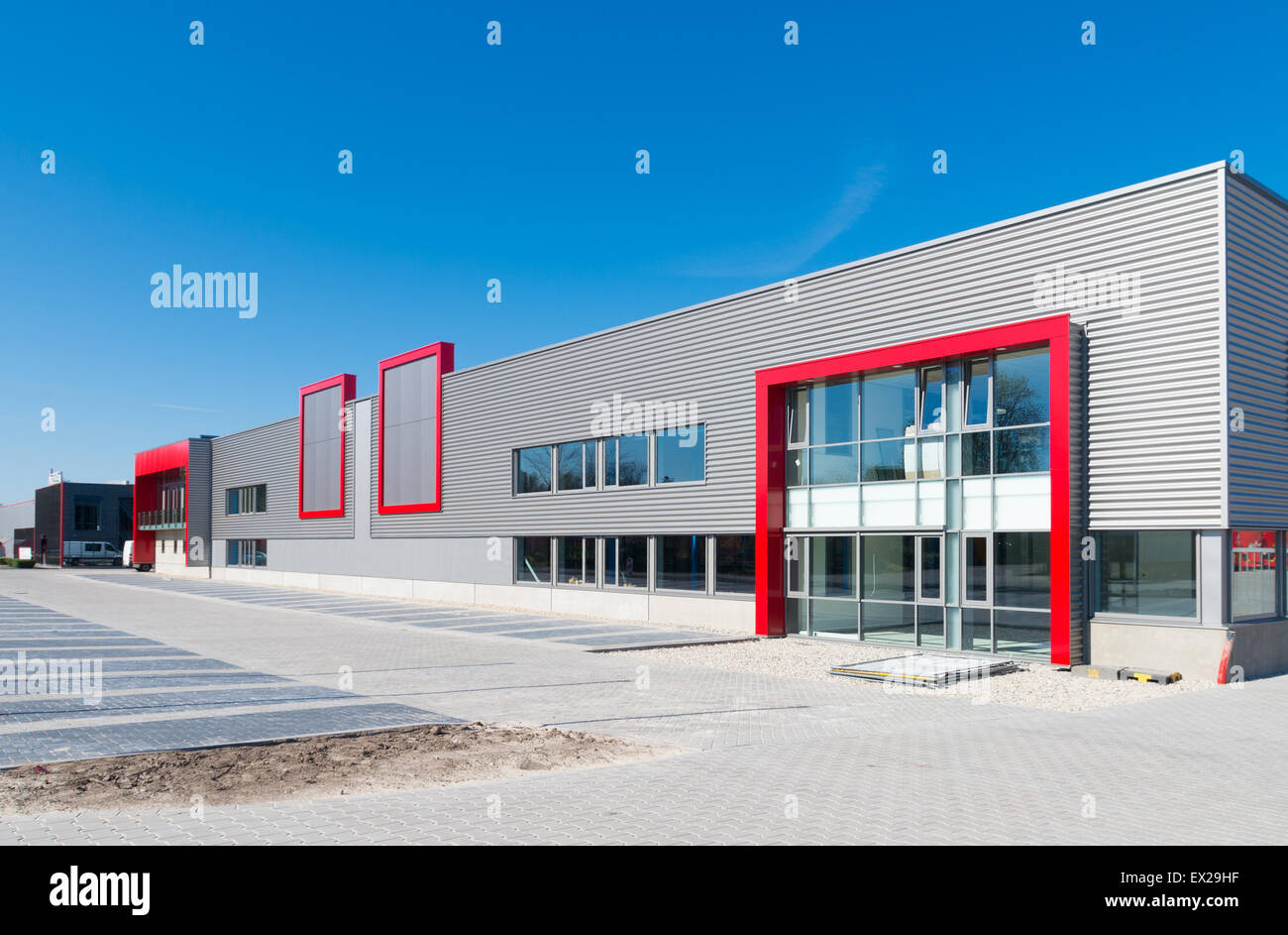newly build modern red office building with warehouse Stock Photo - Alamy