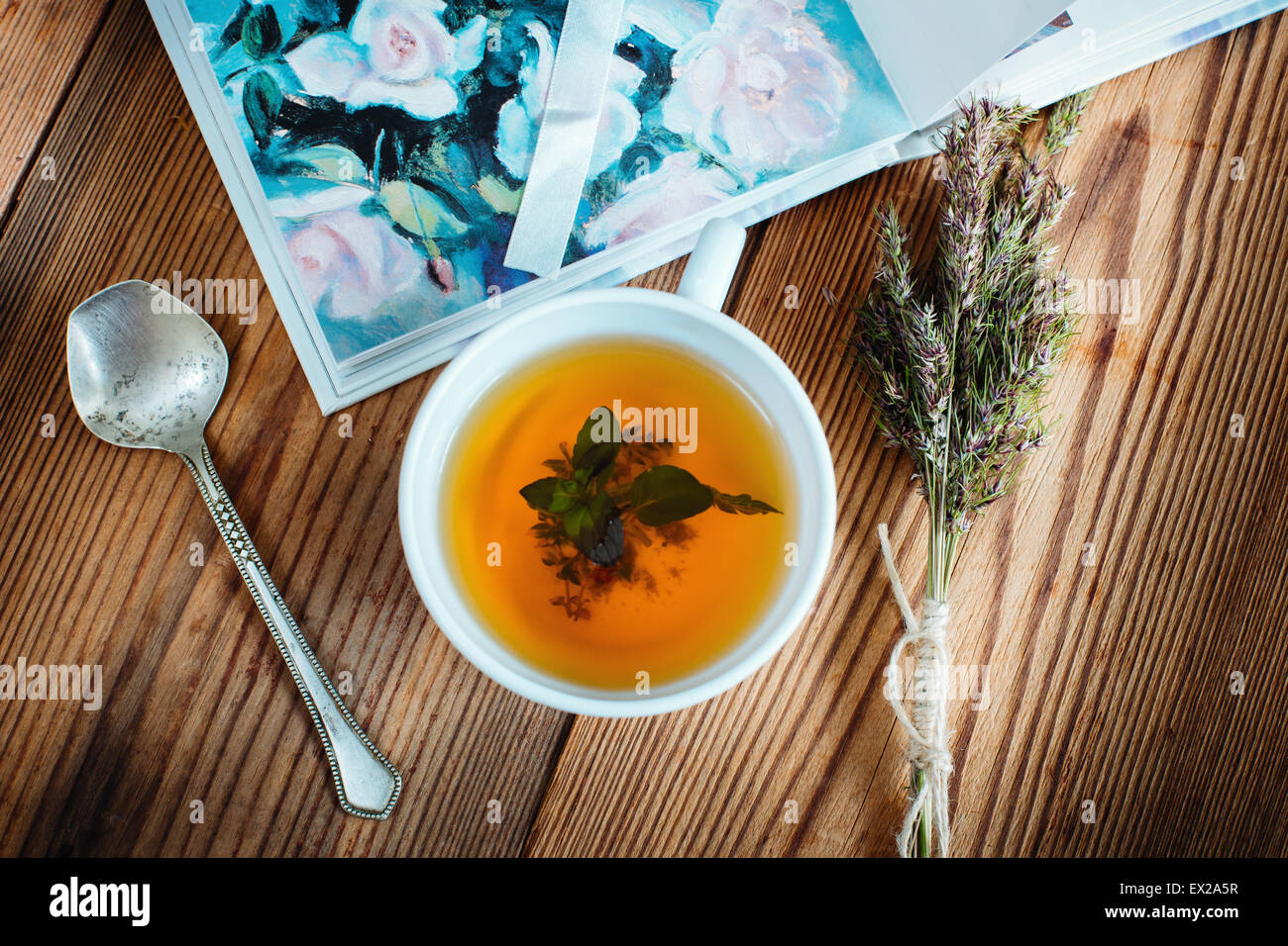 white cap Tea herbs spoon fresh bouquet book Stock Photo - Alamy