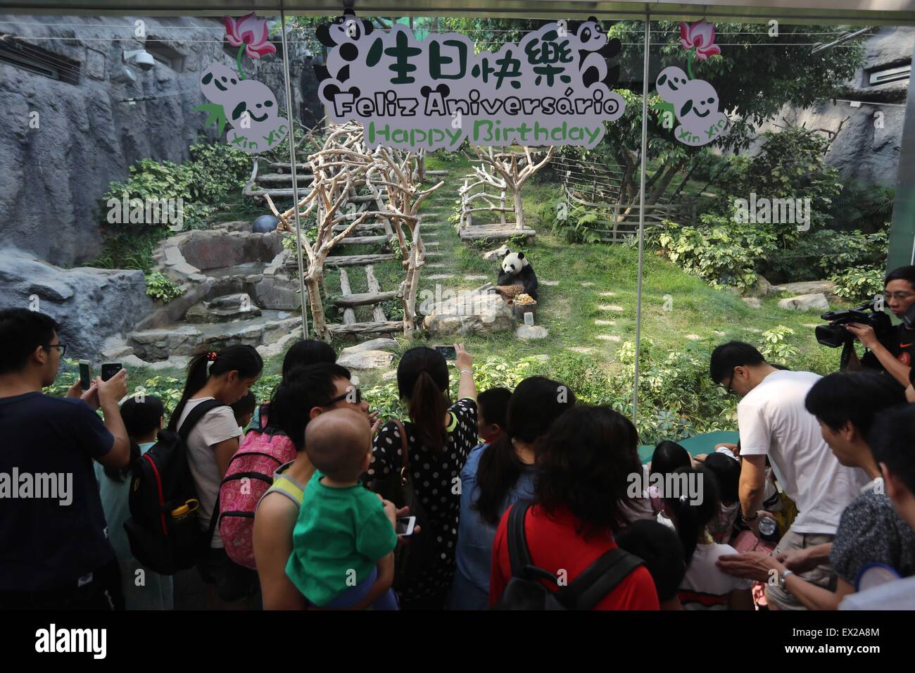 Macao, China. 5th July, 2015. Visitors take pictures of giant panda ...