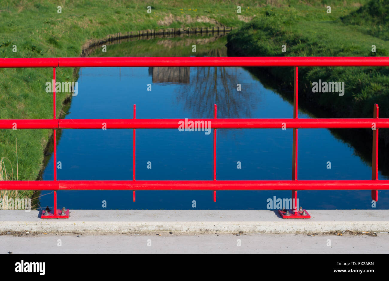 small red bridge over a ditch Stock Photo - Alamy
