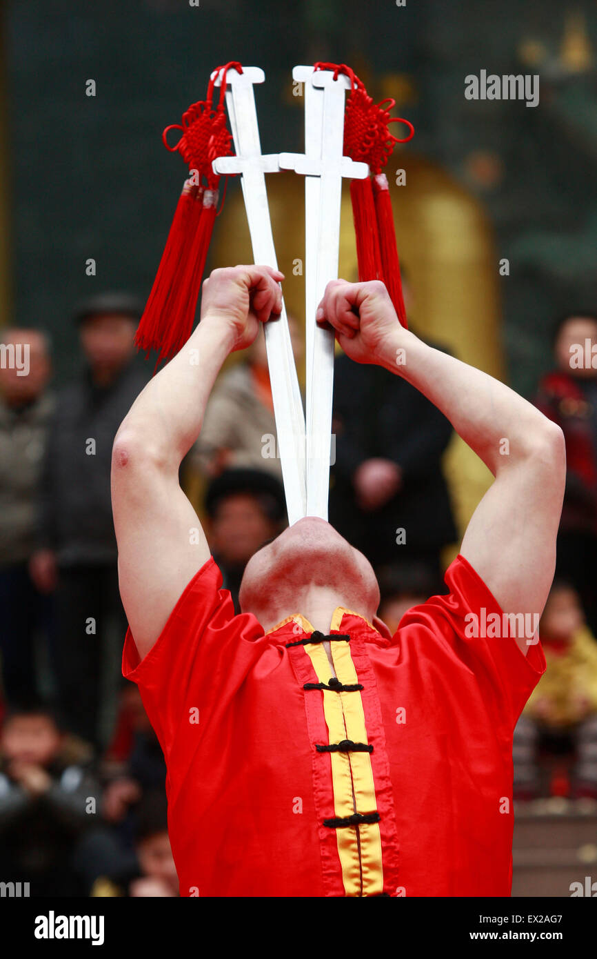 A stunt performer performs to welcome the upcoming Lantern Festival in ...