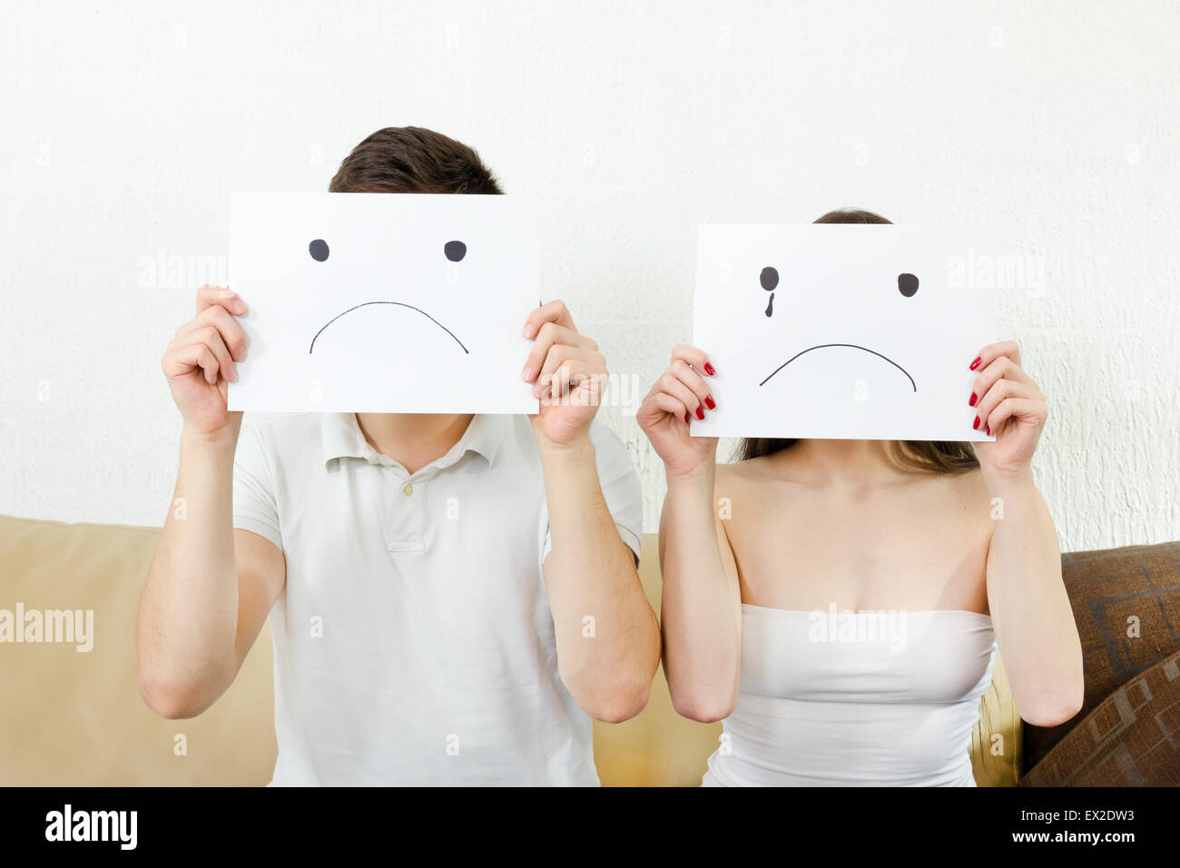 Sad teenagers in despair. Love problems. Sad young couple. Unhappy ...