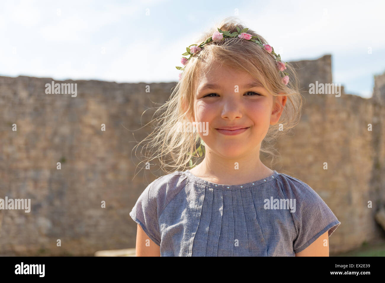 Young princess in front of castle wall Stock Photo - Alamy