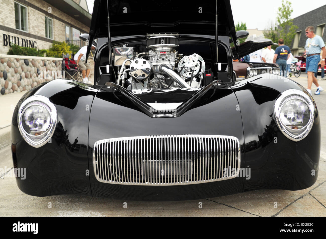Front end of a restored and remodeled 1941 Willys coup. Open engine ...