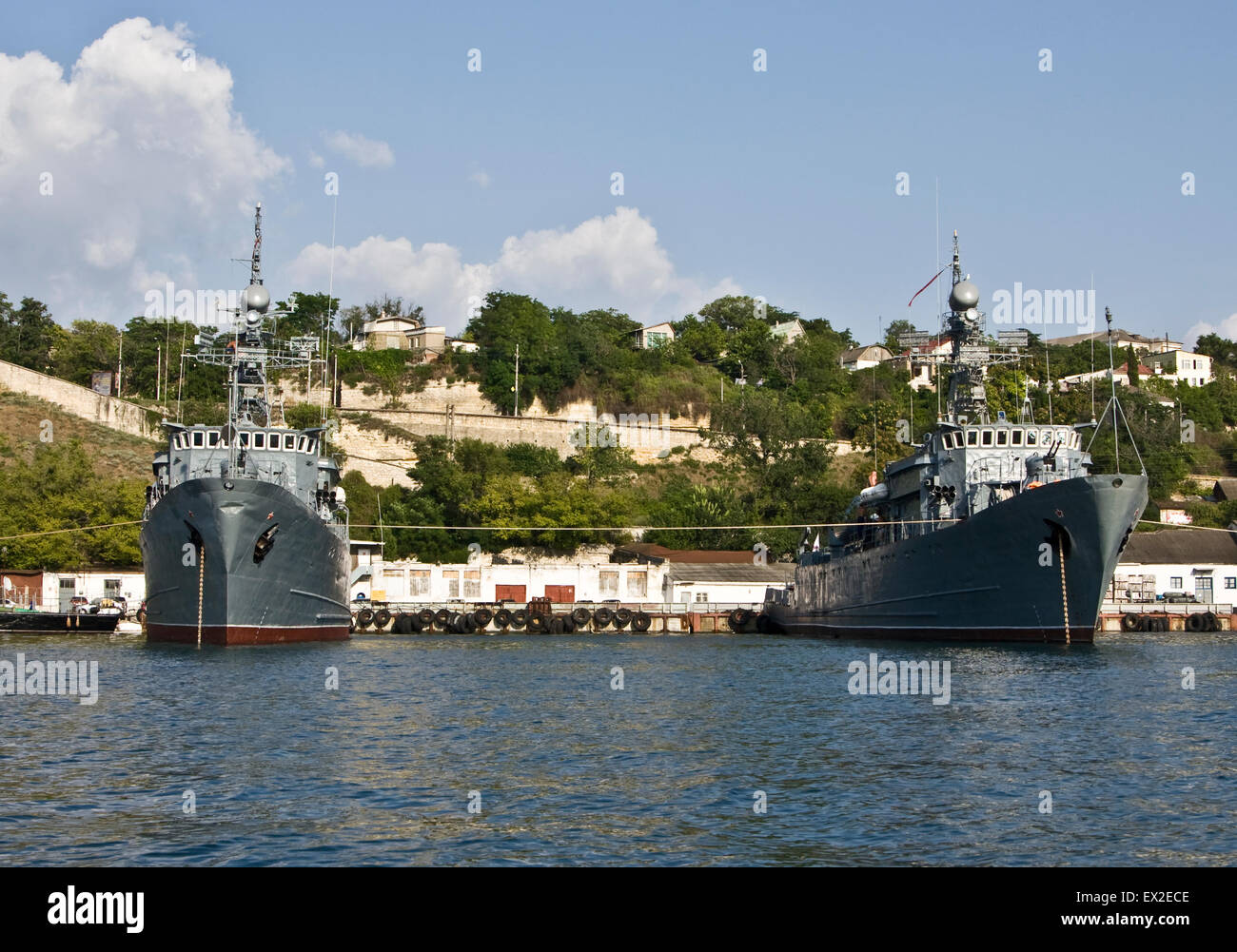 Military ships standing in port in harbour of town Sevastopol in region ...