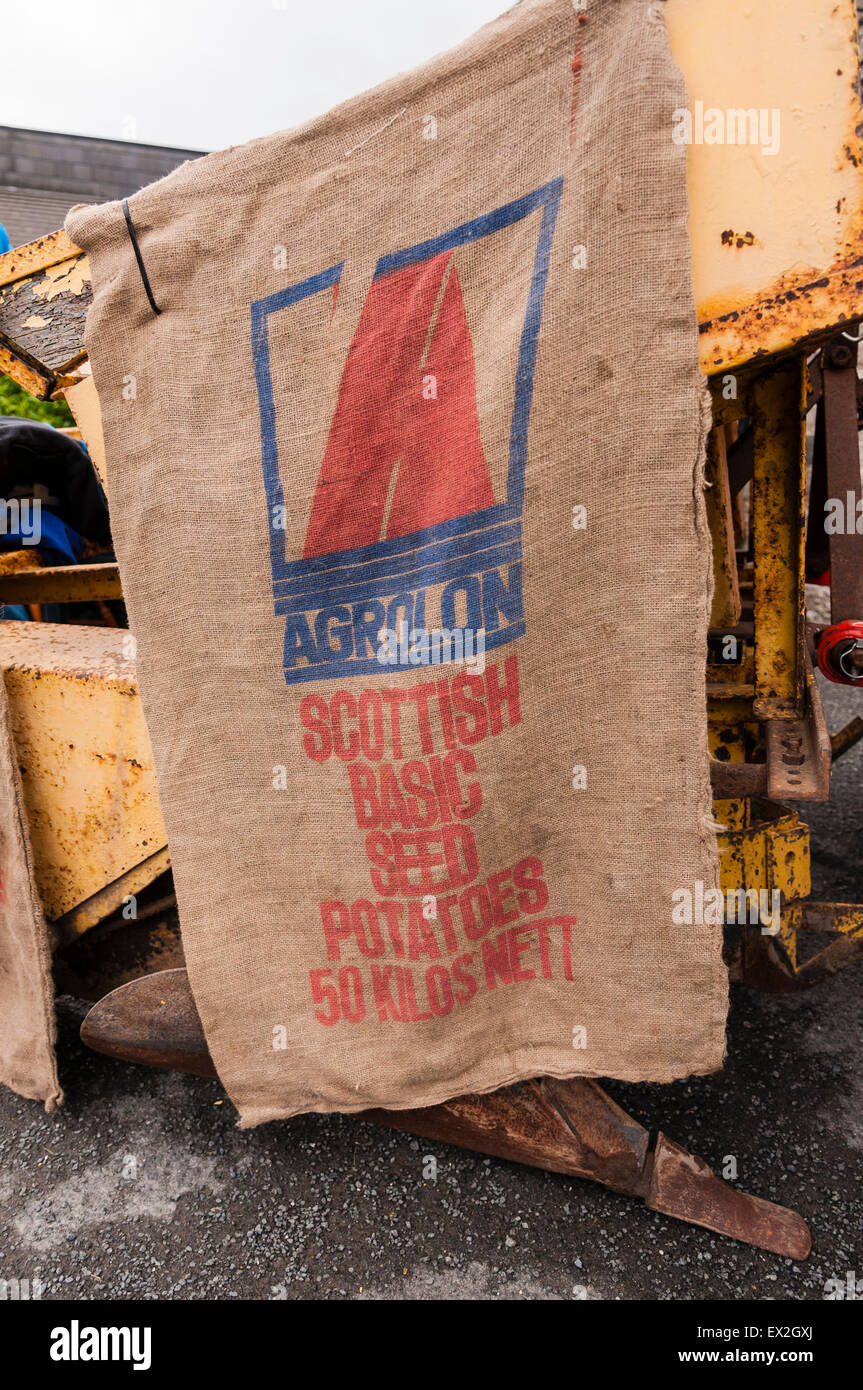Hessian sacks for Scottish basic seed potatoes hang from a potato ...