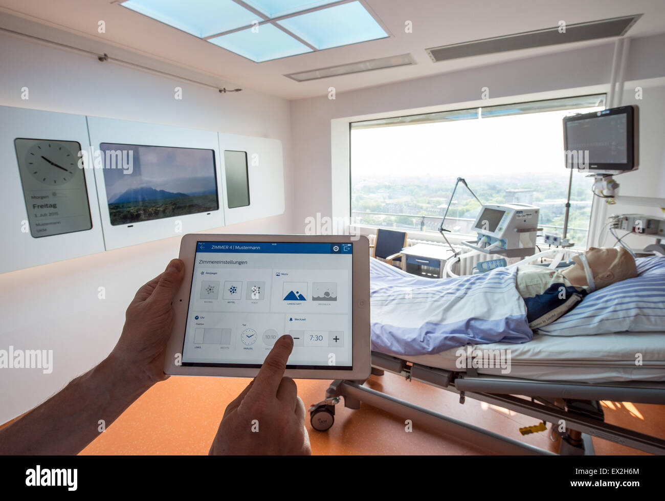 Muenster, Germany. 03rd July, 2015. A nurse shows how to operate a ...