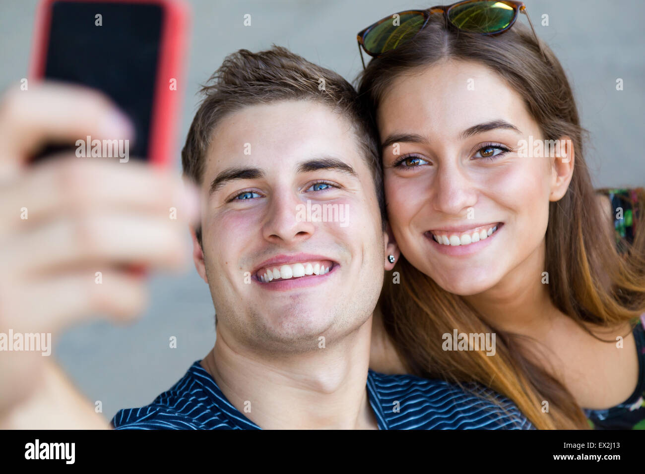 Portrait of young students taking photos with a smartphone in the ...