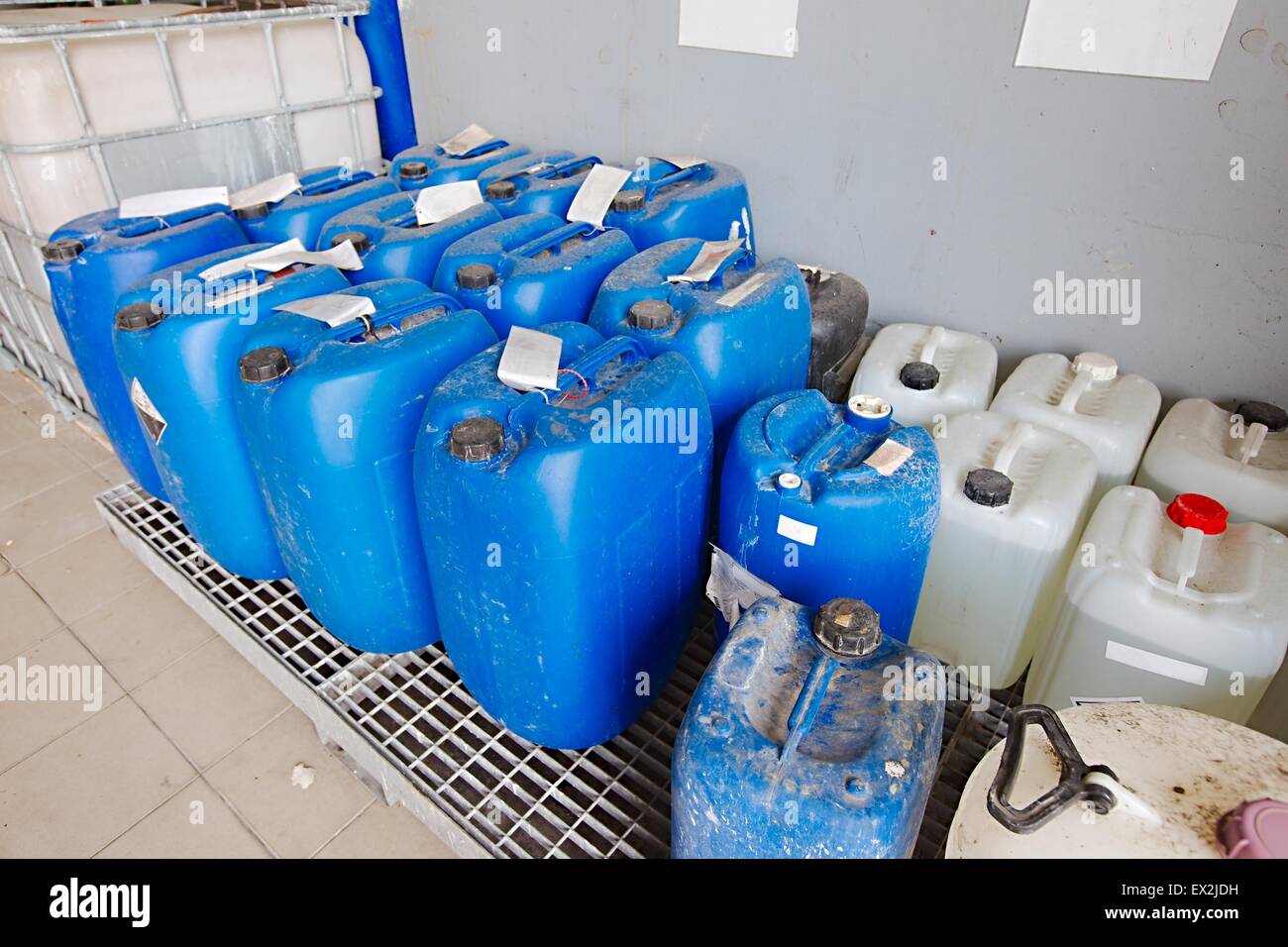 Plastic cans of chemicals Stock Photo - Alamy