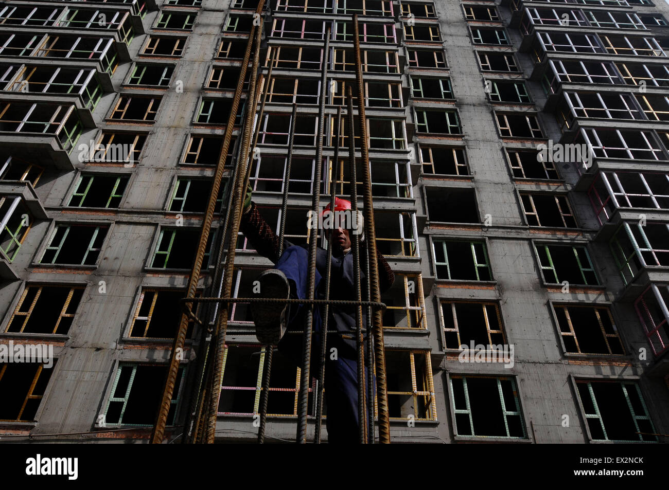 A labourer works at a construction site of a residential area in ...