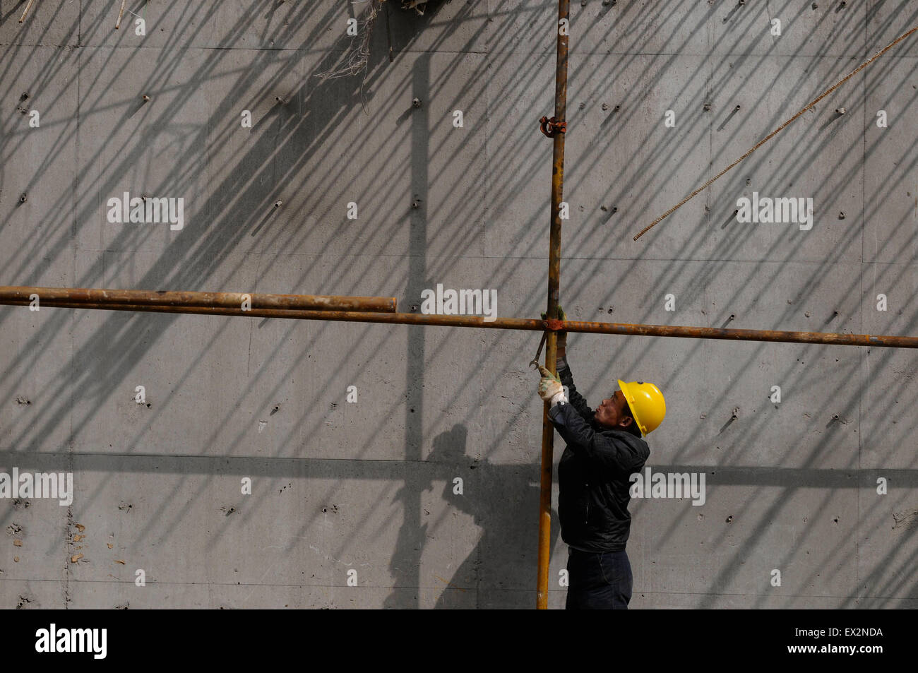 A labourer works at a construction site of a residential area in ...
