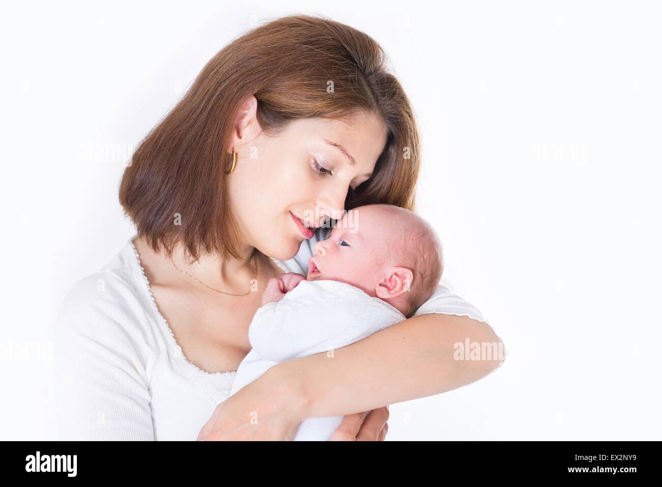 Beautiful young mother holding her sweet newborn baby Stock Photo - Alamy