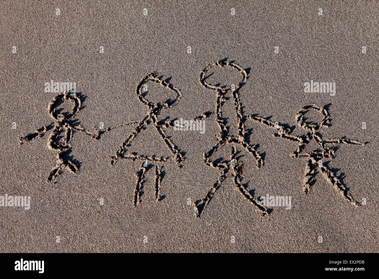 Family drawing in sand hi-res stock photography and images - Alamy