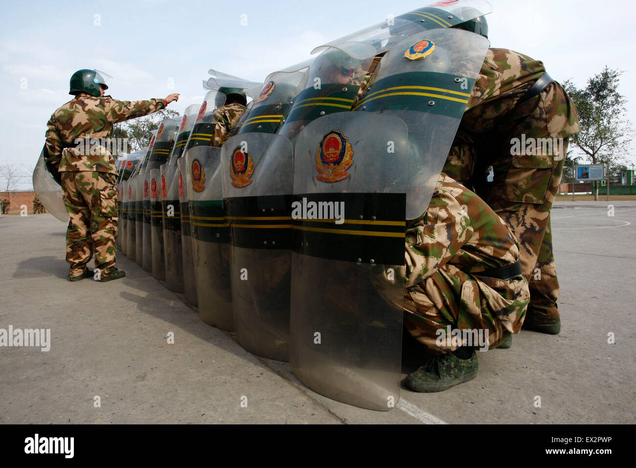 Paramilitary policemen train with riot shields during an anti-terrism ...
