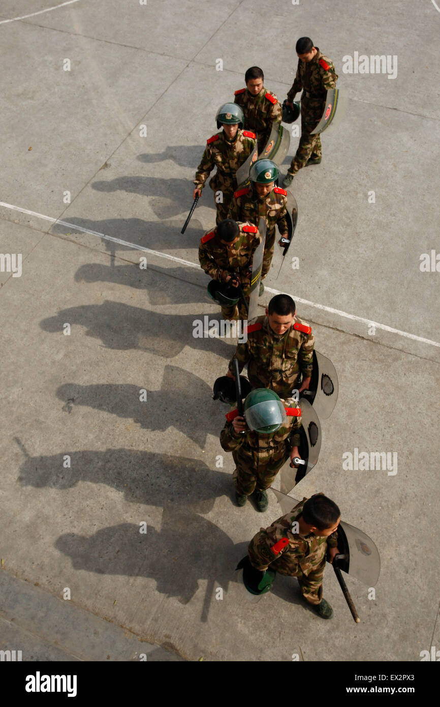 Paramilitary policemen train with riot shields during an anti-terrism ...