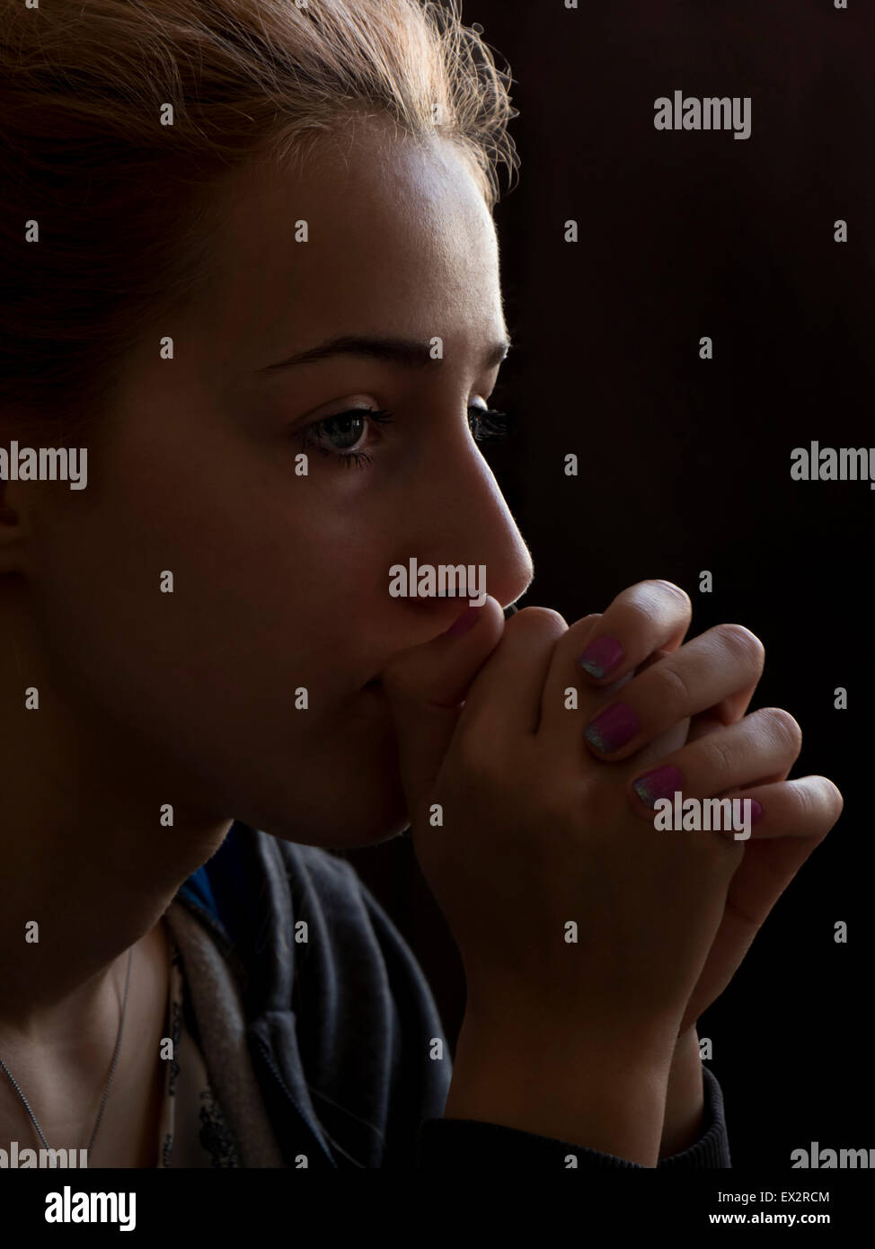 Teenager beautiful low key Stock Photo - Alamy