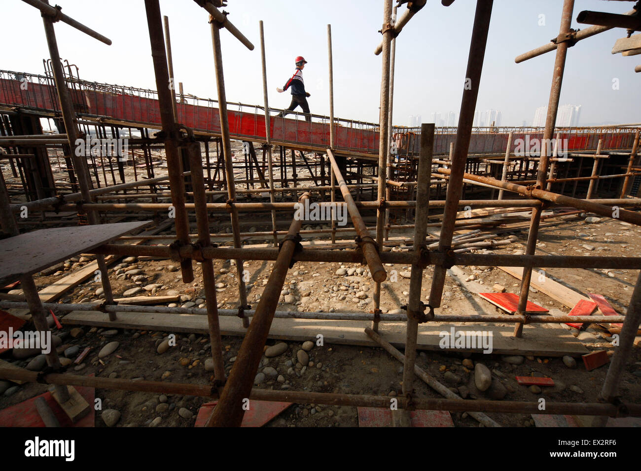 A labourer works at a construction site of a wetland park in Suining ...
