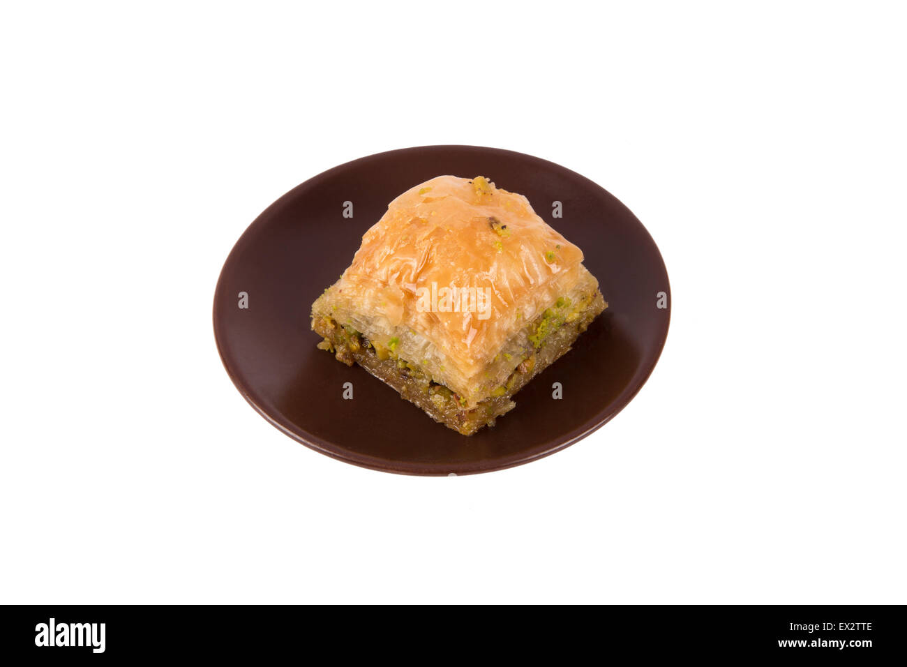Front view of baklava serving on a plate, isolated on white background ...