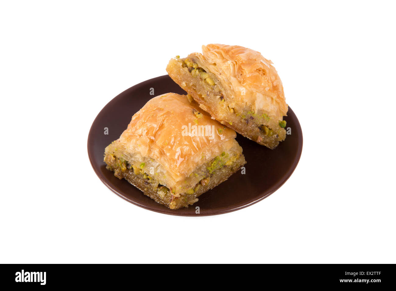 Front view of baklava serving on a plate, isolated on white background ...