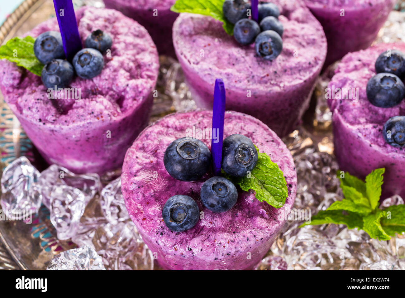 Homemade blueberry popsicles made in plastic cups Stock Photo - Alamy