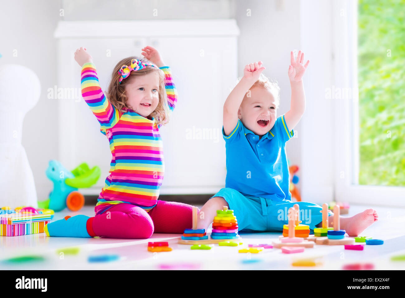 Preschooler child playing with colorful toy blocks. Kids play with ...