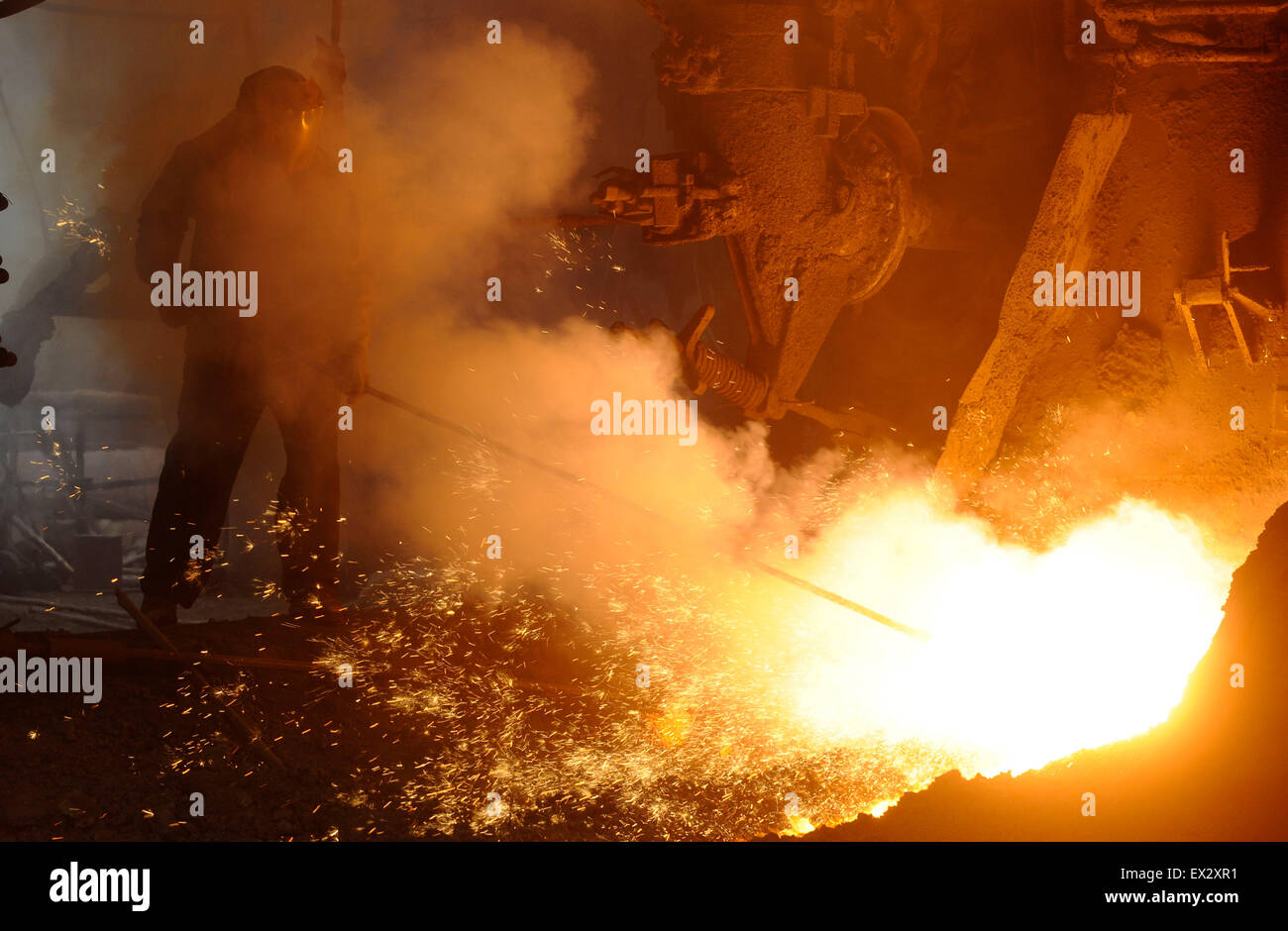 A labourer works at a workshop of Changning Steel and Iron Factory in ...