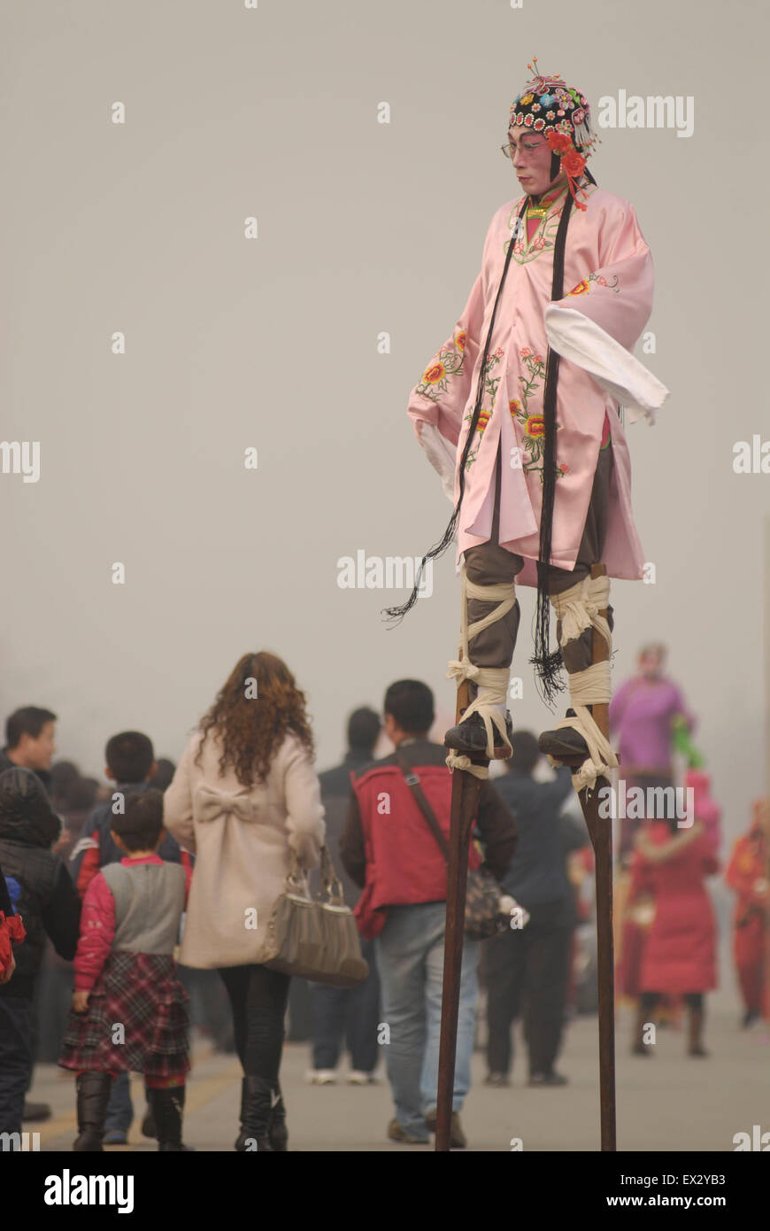 Performers attend a parade to celebrate the upcoming Lantern Festival ...