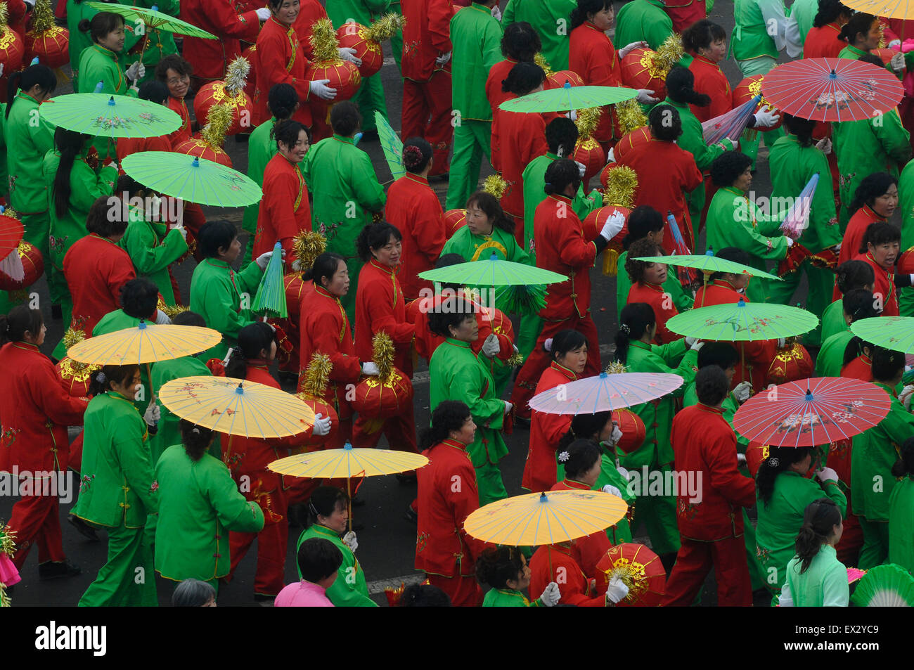 Participants perform during a mass parade to celebrate the lantern ...