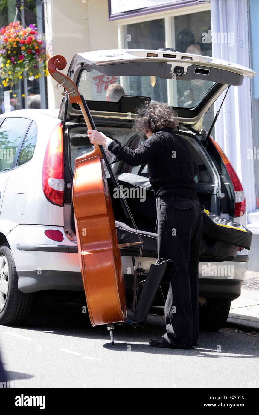 Trying to get Large Instrument into Small Car Double Bass Stock Photo ...