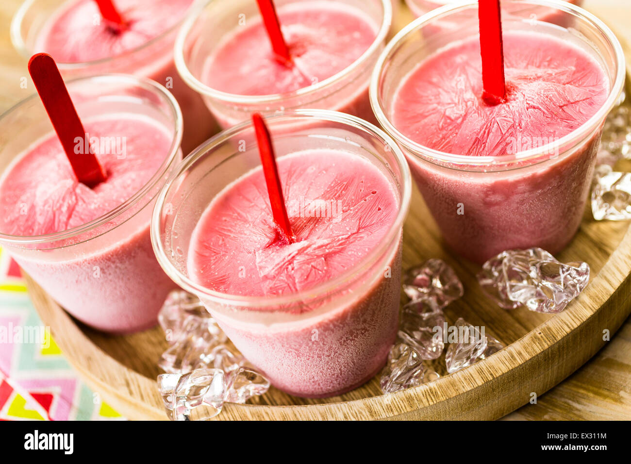 Homemade strawberry popsicles made in plastic cups Stock Photo - Alamy