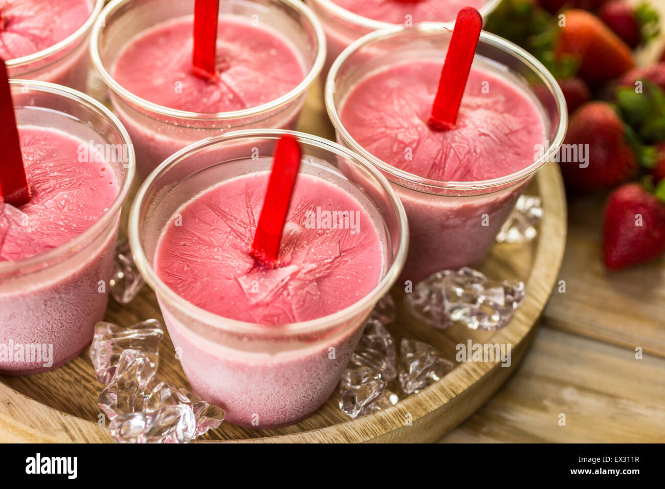 Homemade strawberry popsicles made in plastic cups Stock Photo - Alamy