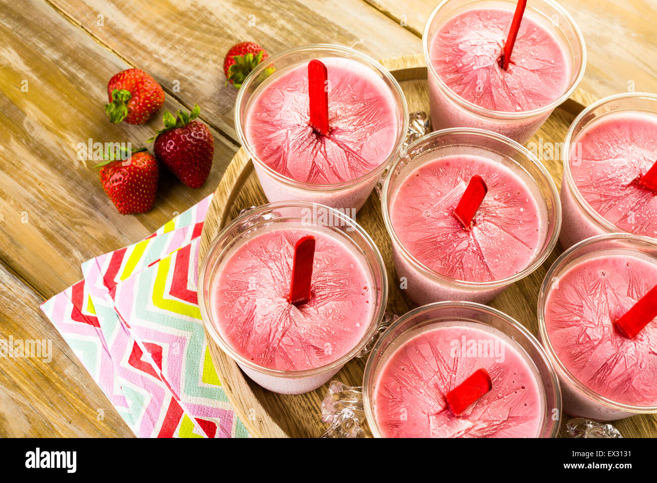 Homemade strawberry popsicles made in plastic cups Stock Photo - Alamy