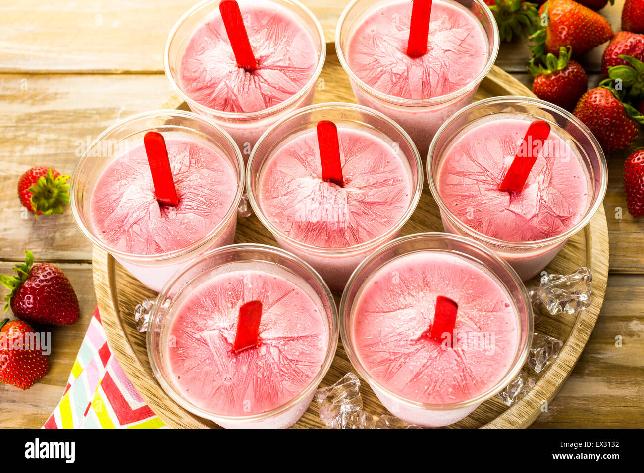 Homemade strawberry popsicles made in plastic cups Stock Photo - Alamy