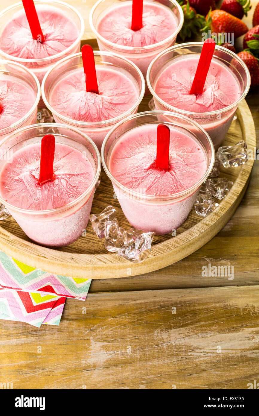 Homemade strawberry popsicles made in plastic cups Stock Photo - Alamy